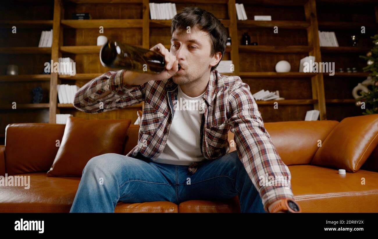 Alcohol addiction at young age. Caucasian male cannot stop drinking ...