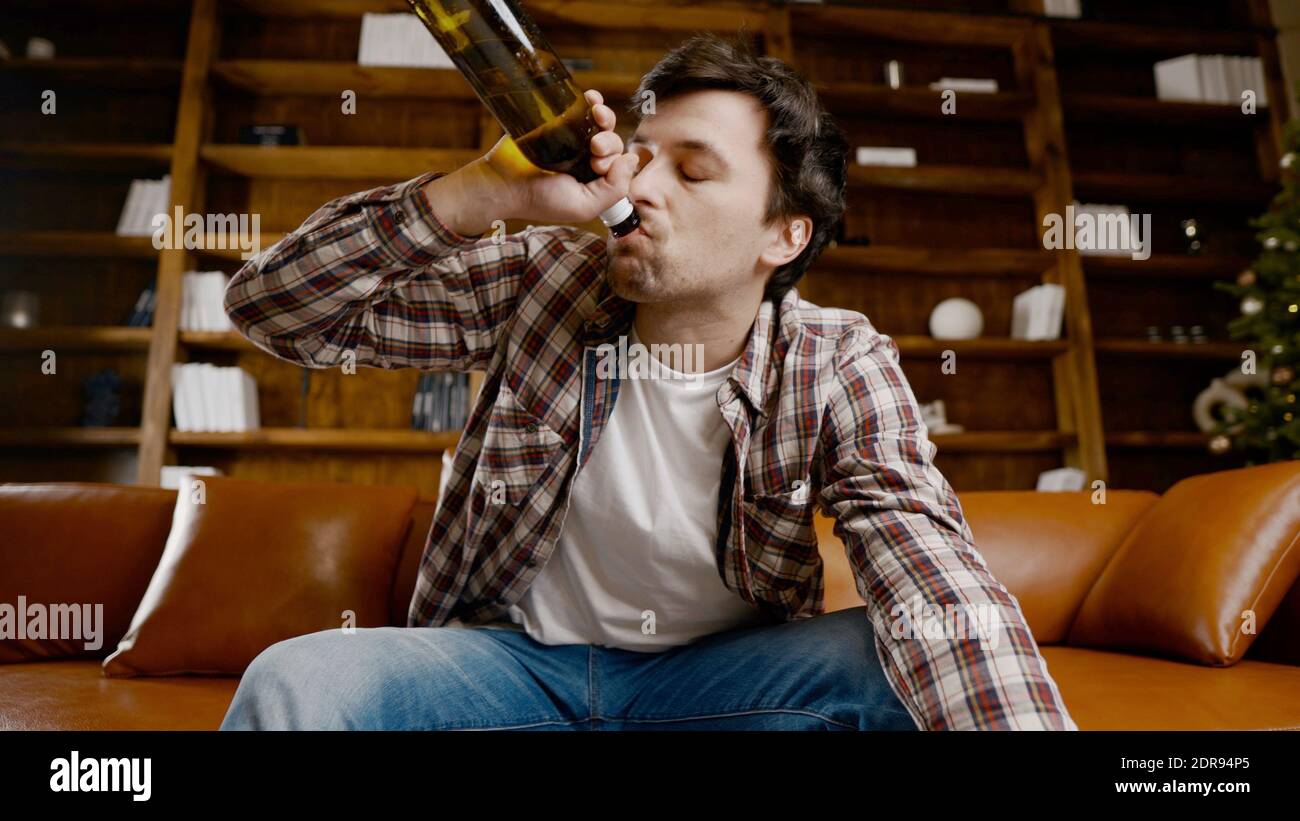 Alcohol addiction at young age. Caucasian male cannot stop drinking ...