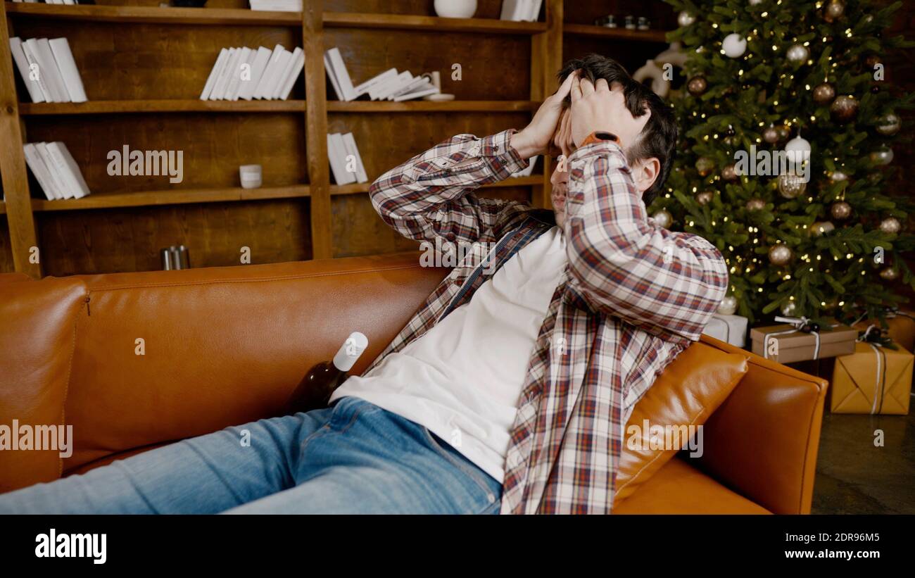 Alcohol addiction at young age. Caucasian male cannot stop drinking ...