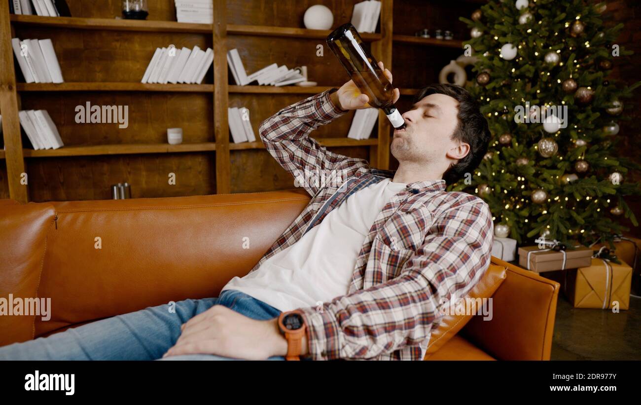 Alcohol addiction at young age. Caucasian male cannot stop drinking ...