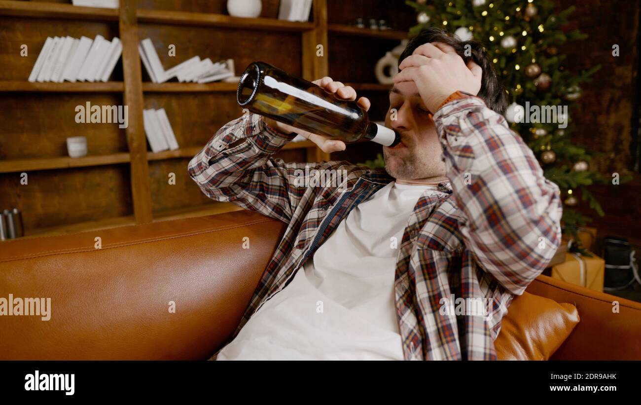 Alcohol addiction at young age. Caucasian male cannot stop drinking ...