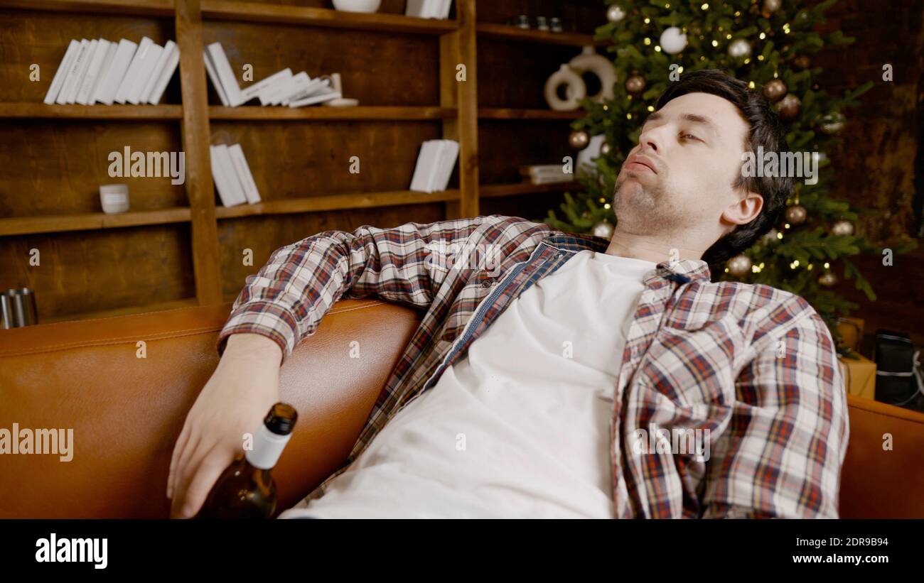 Alcohol addiction at young age. Caucasian male cannot stop drinking ...