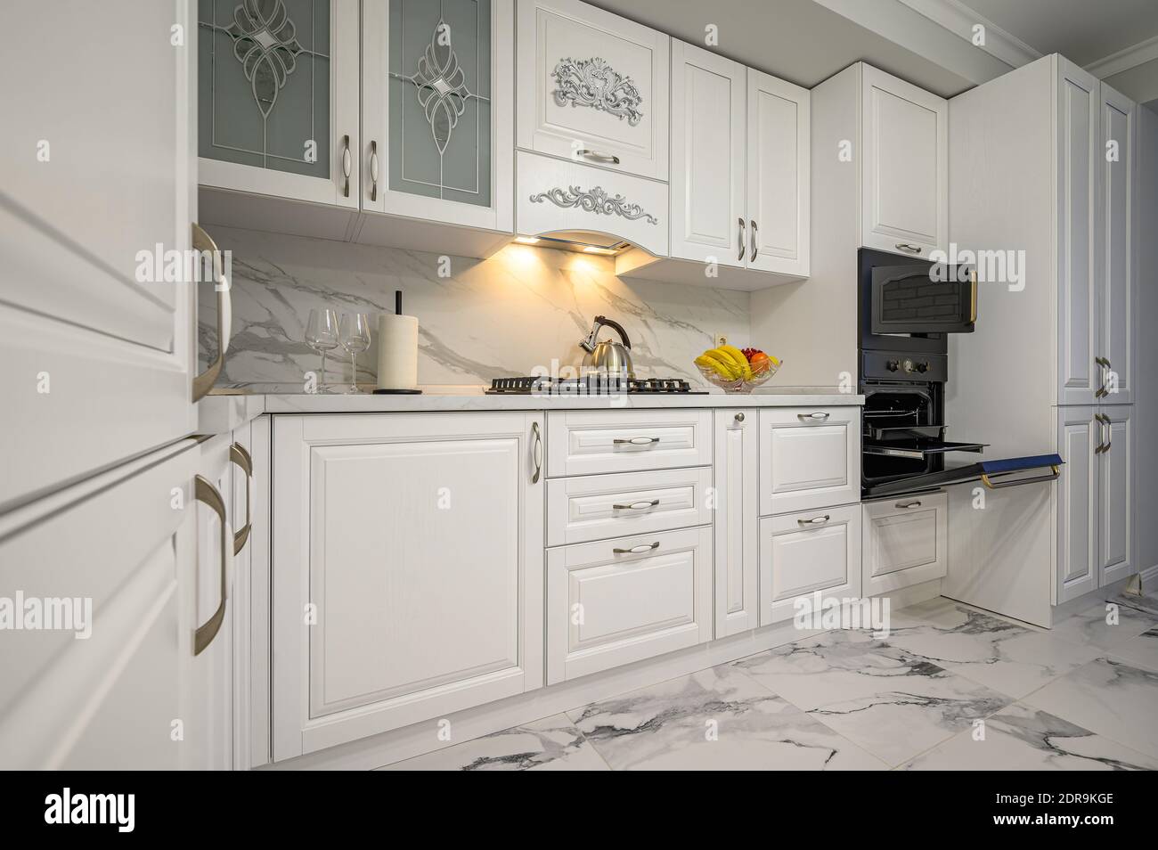 White kitchen in classic style, front view Stock Photo - Alamy