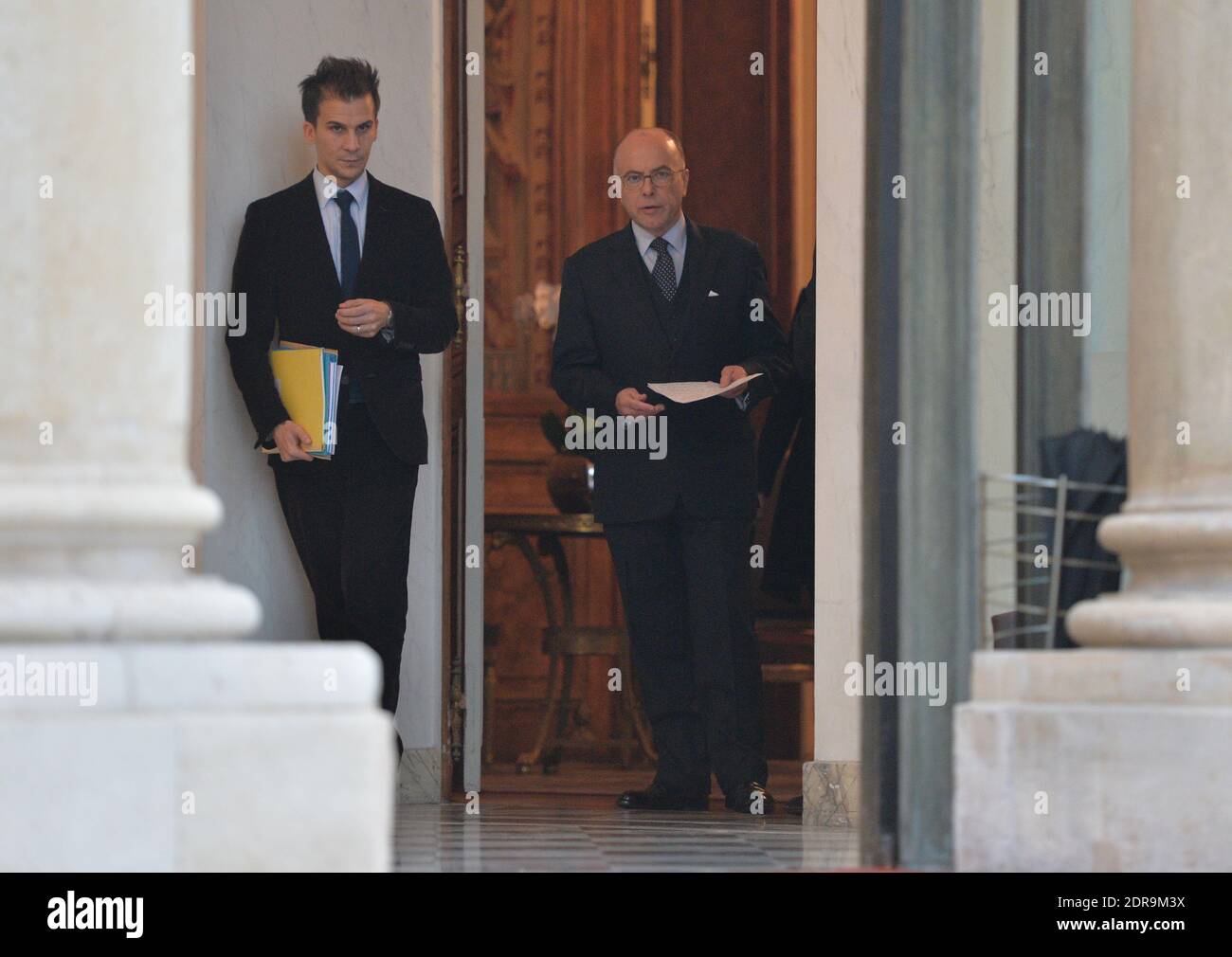 Minister of the Interior Bernard Cazeneuve and Gaspard Gantzer leave ...