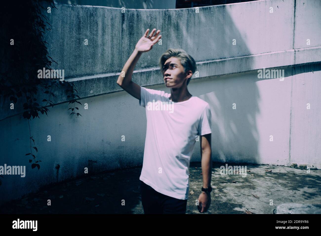 Shadow man one arm raised hi-res stock photography and images - Alamy