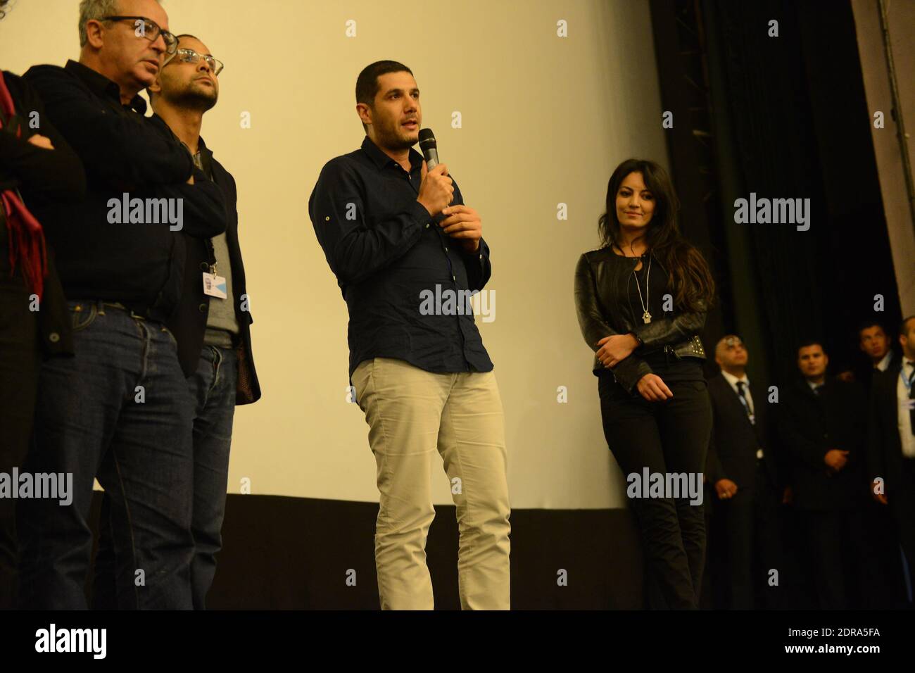 Morocco's director Nabil Ayouch (center) arrives under heavy security ...