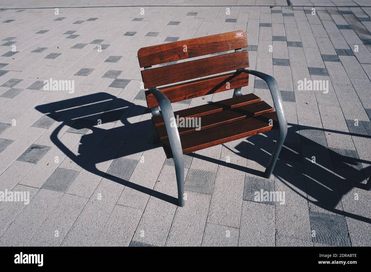 Bench In The Street Stock Photo - Alamy