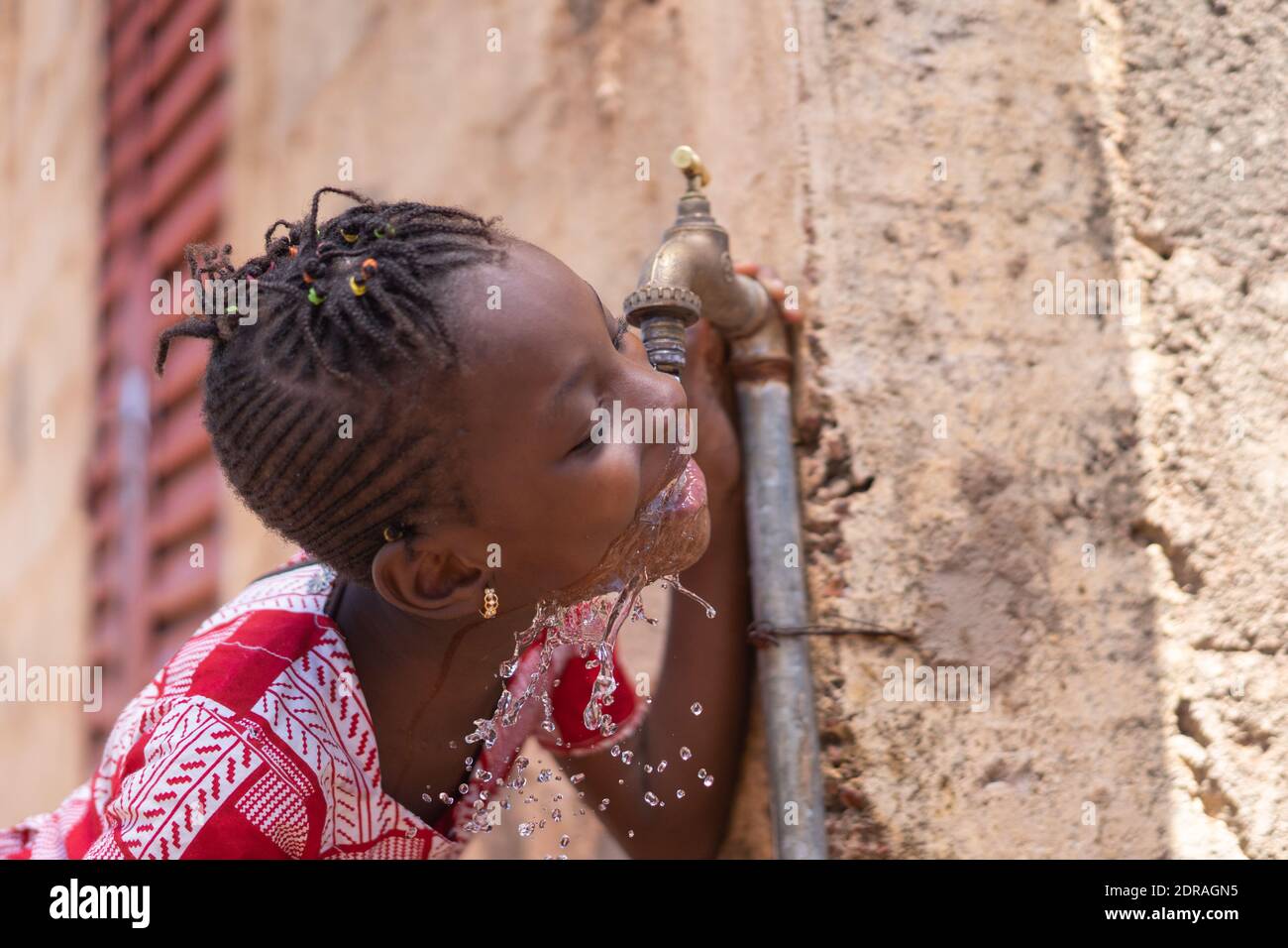 African girl drinking water faucet hi-res stock photography and images ...