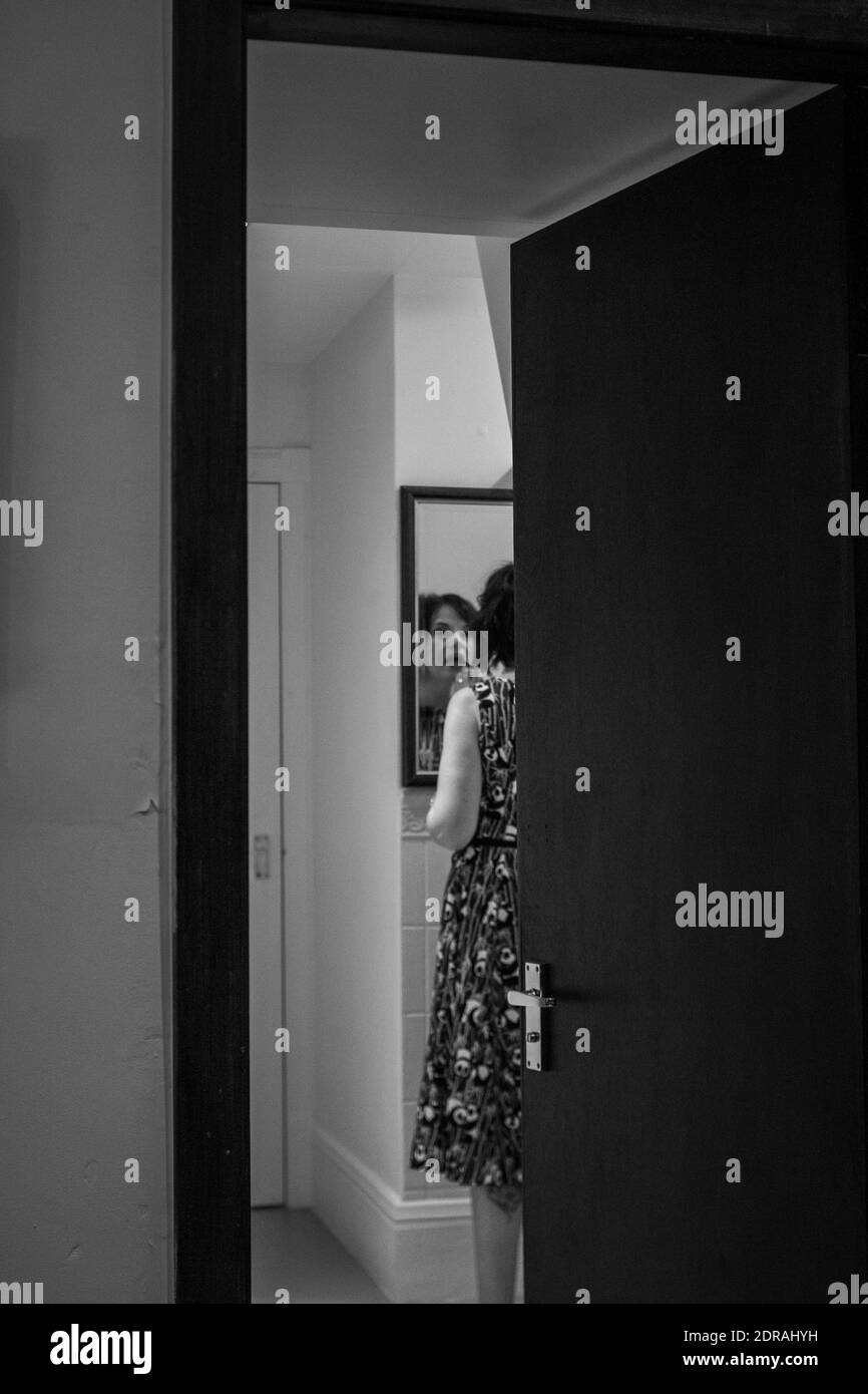 Woman doorway rear view Black and White Stock Photos & Images - Alamy