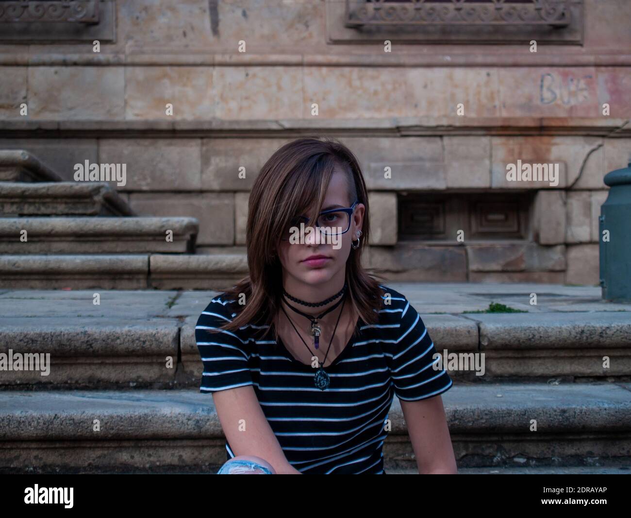 Portrait Of Teenage Girl Sitting On Steps Stock Photo - Alamy