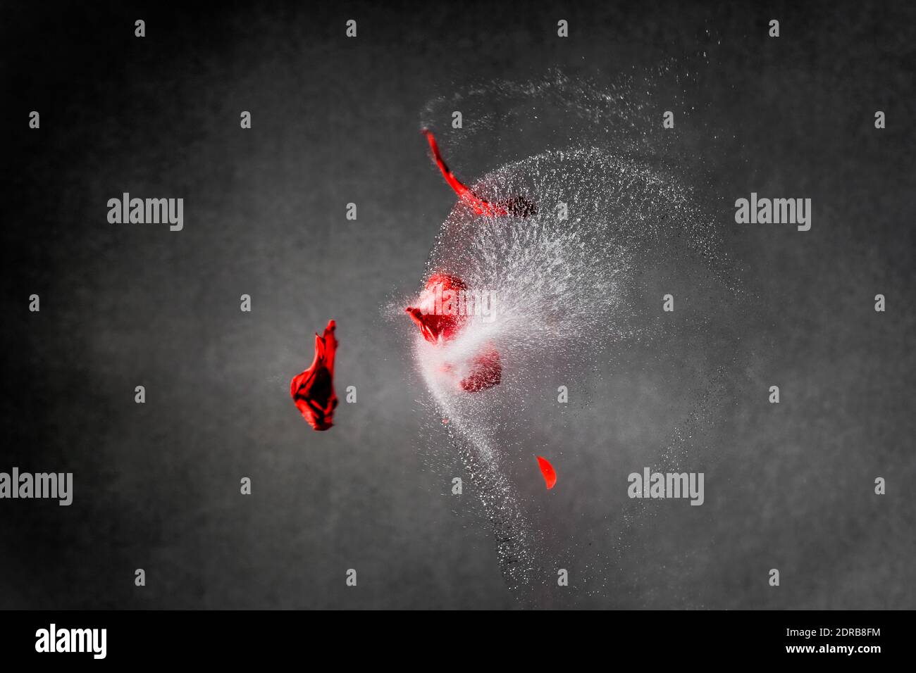 Red water balloon burst hi-res stock photography and images - Alamy