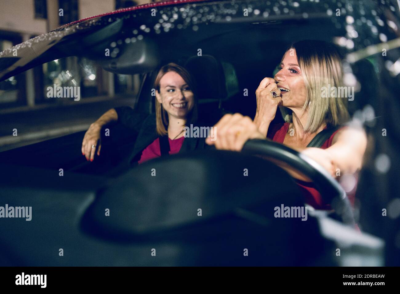 Happy people in car at night hi-res stock photography and images - Alamy