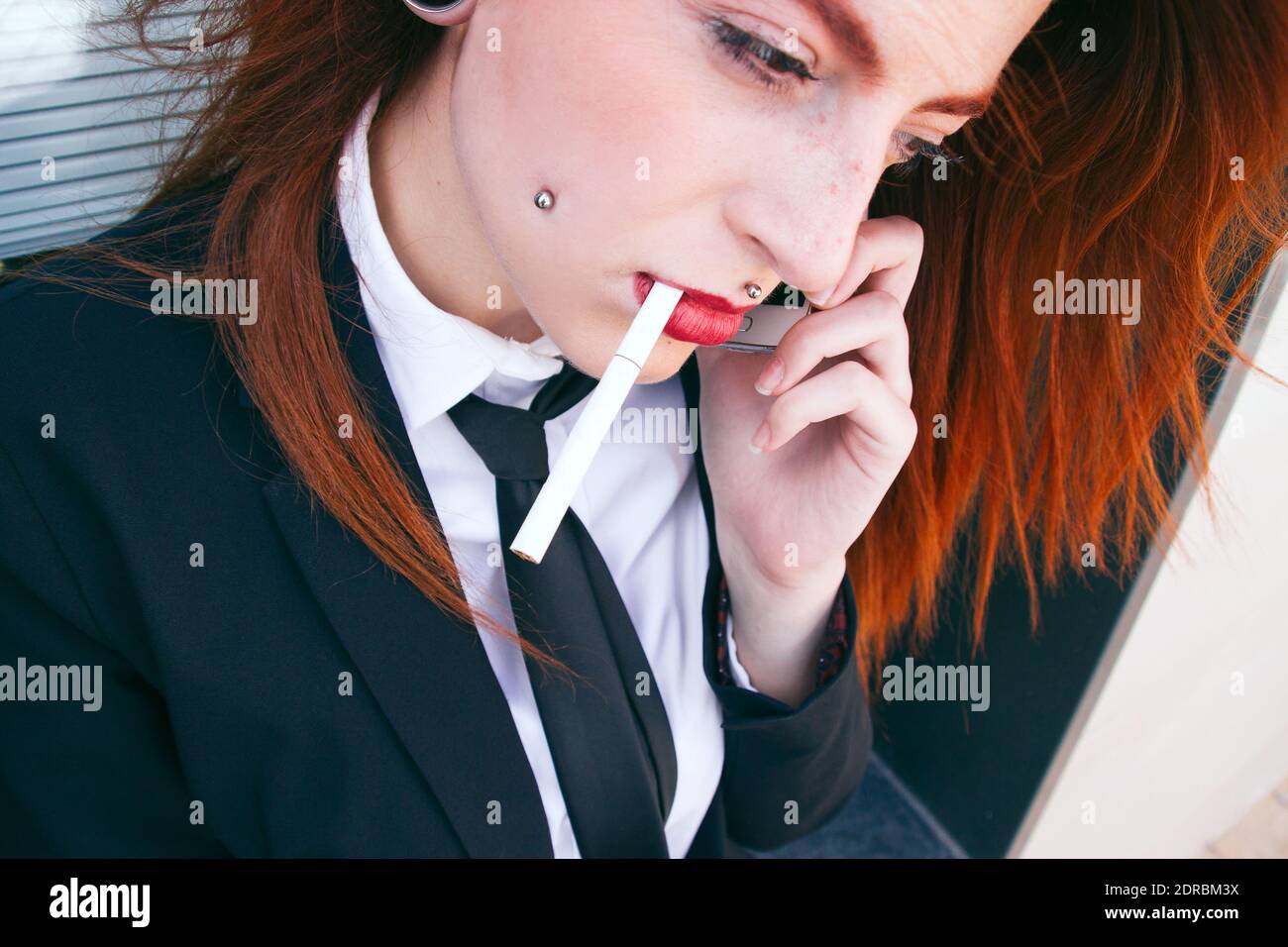 Beautiful redhead woman smoking cigarette hi-res stock photography and ...