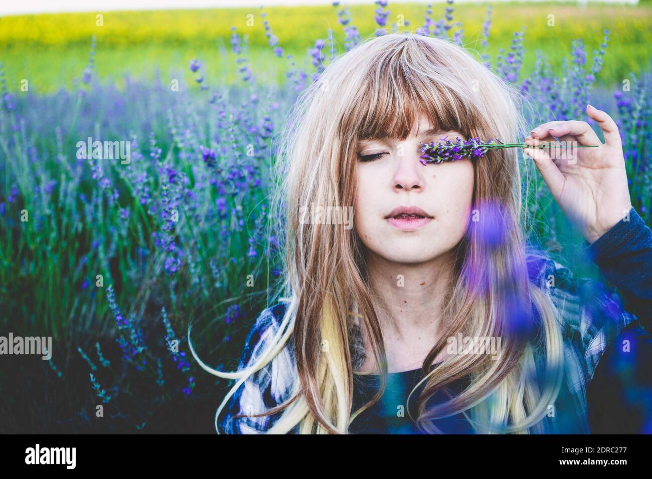 Woman flower over one eye hi-res stock photography and images - Alamy