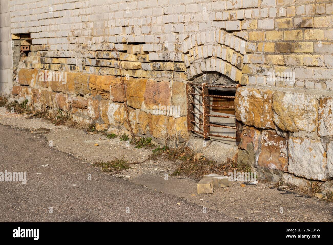 Full frame view of an eroding antique exterior brick wall surface with ...