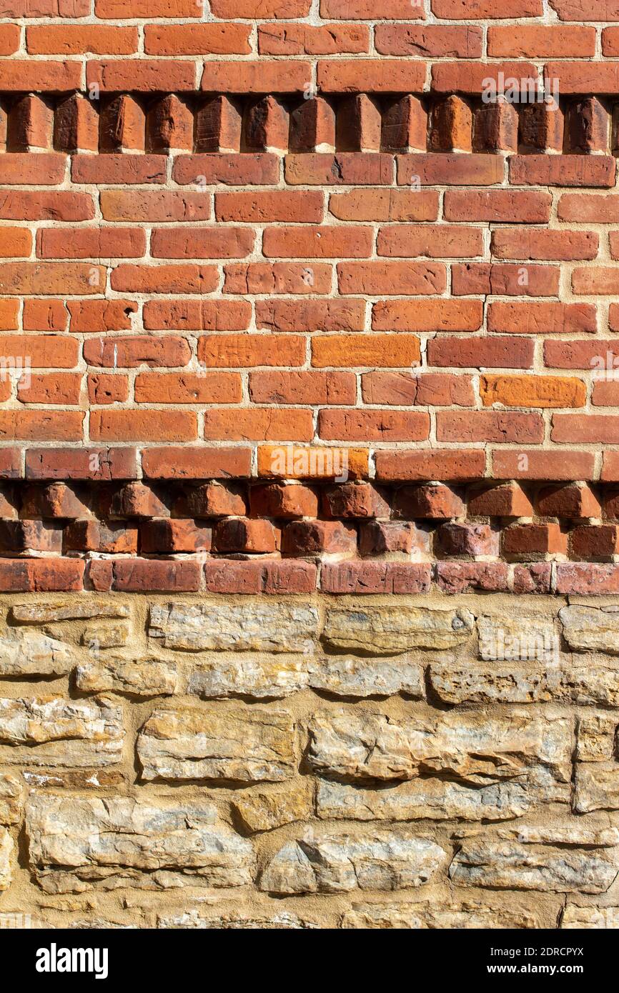 Texture background of a rugged old exterior red clay brick and white ...