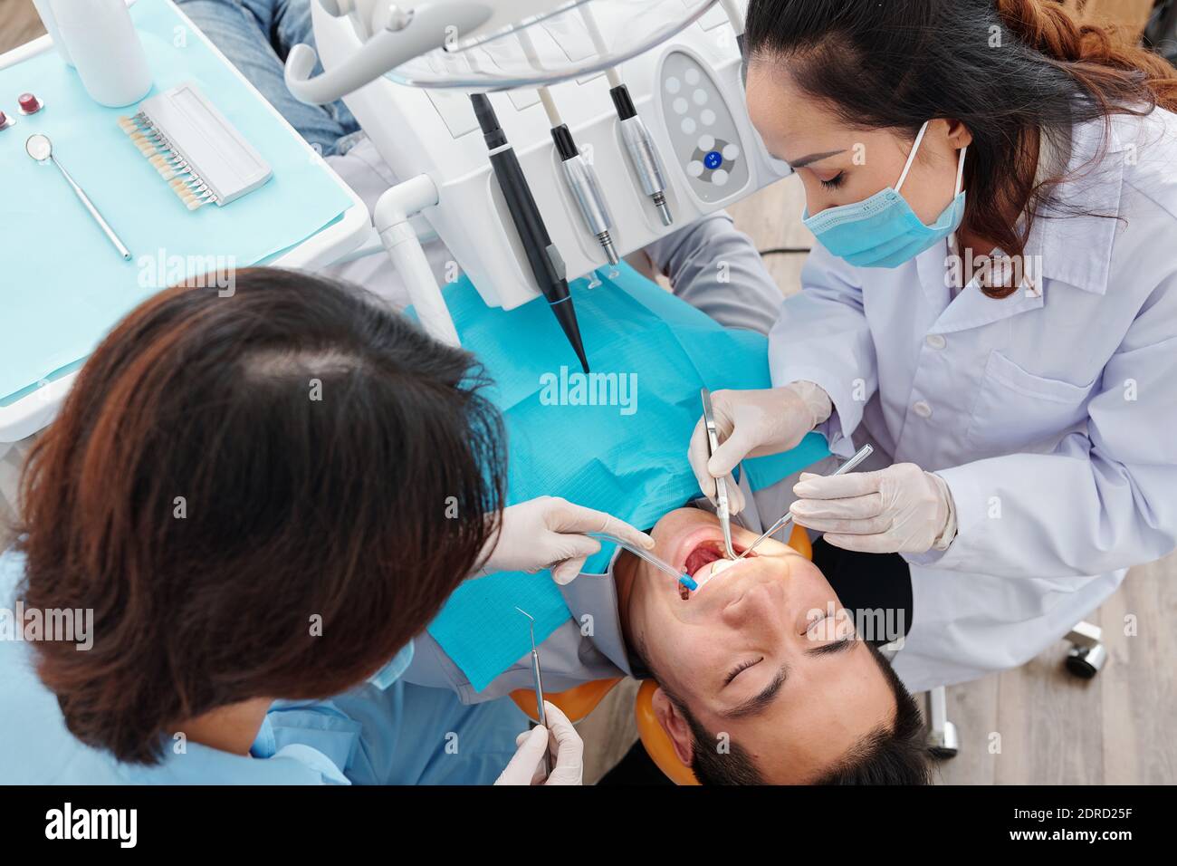 Treating teeth of patient Stock Photo - Alamy