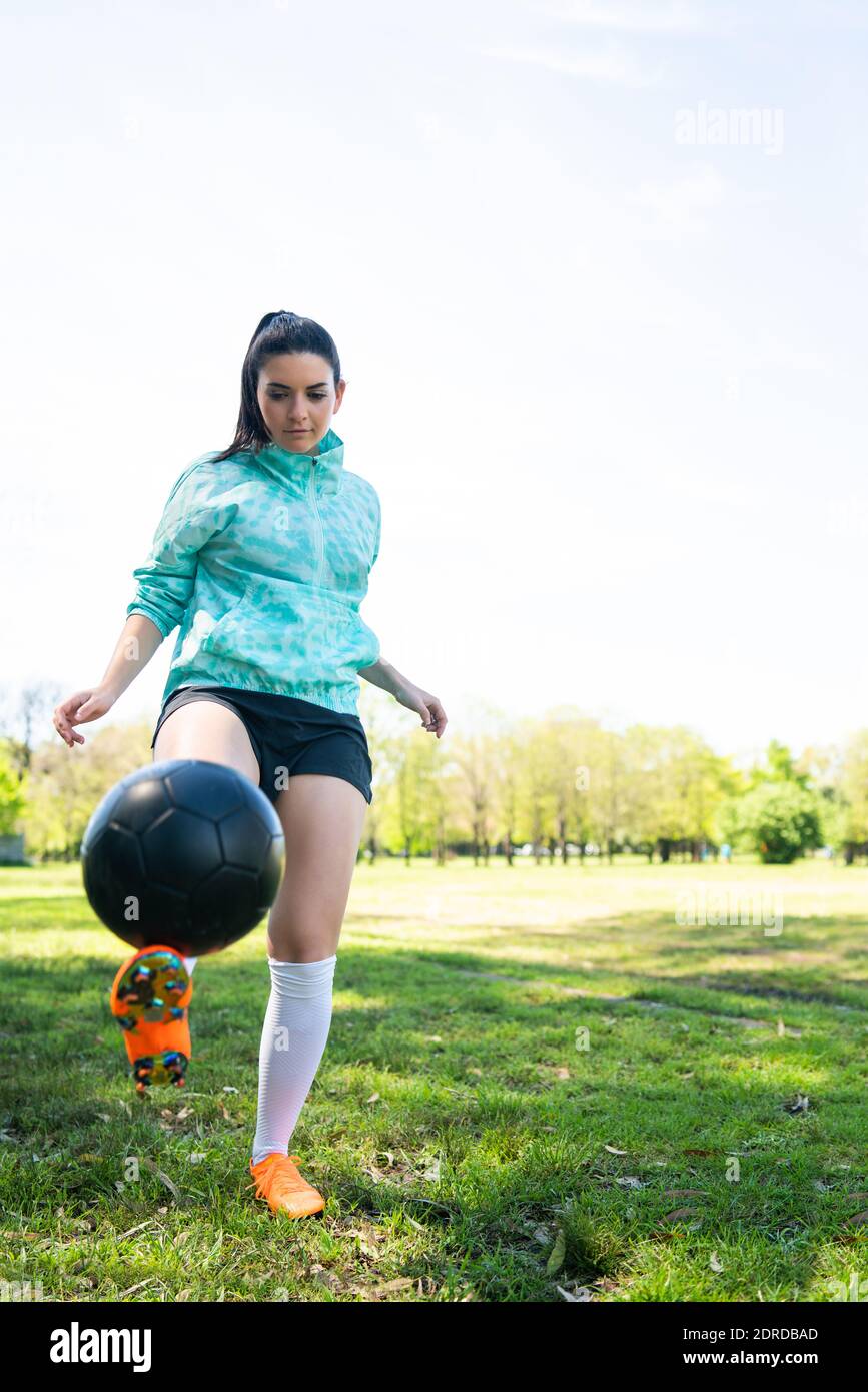 Female athlete is practicing her soccer skills hi-res stock photography ...