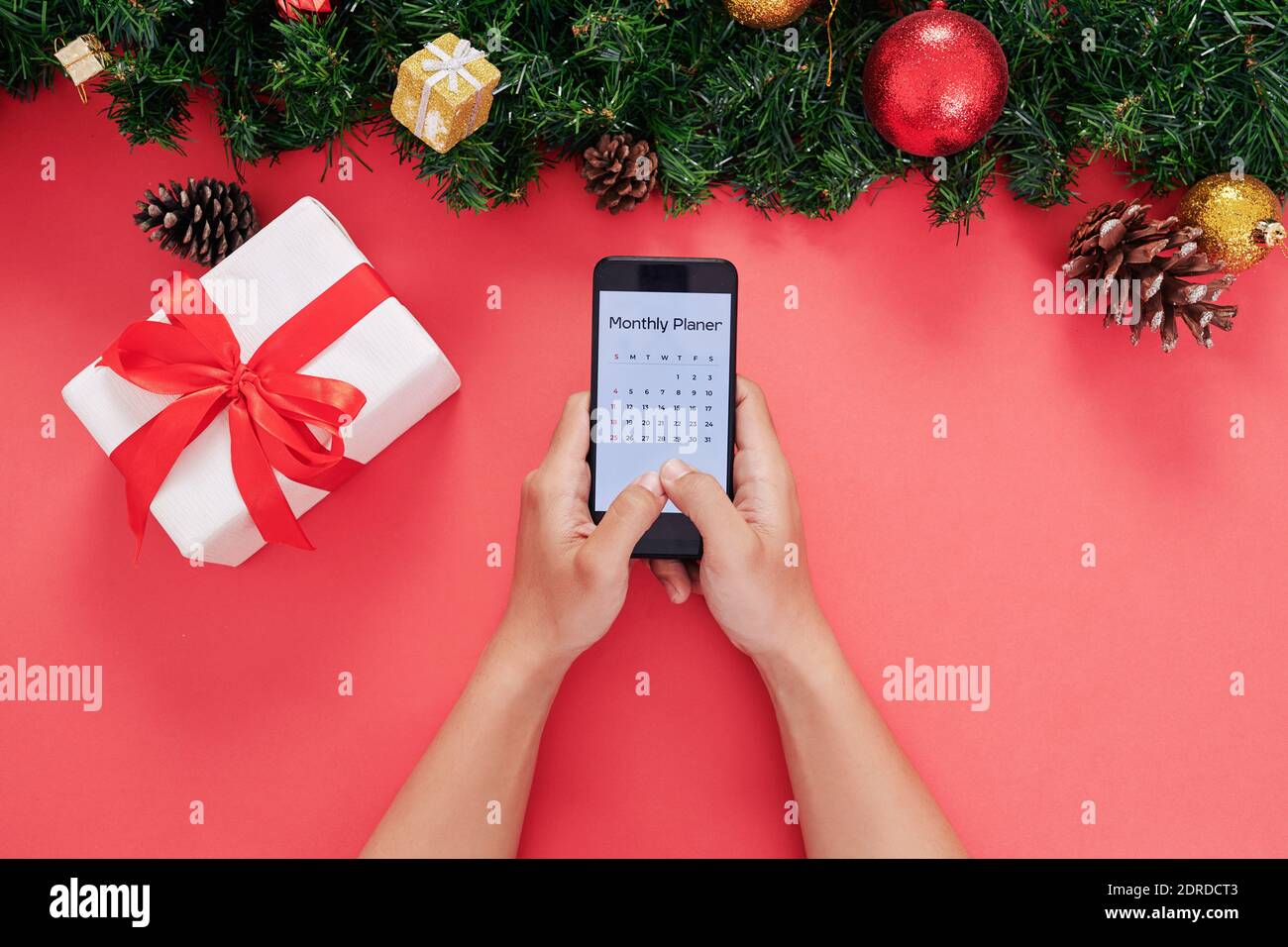 Man checking calendar on smartpone Stock Photo - Alamy