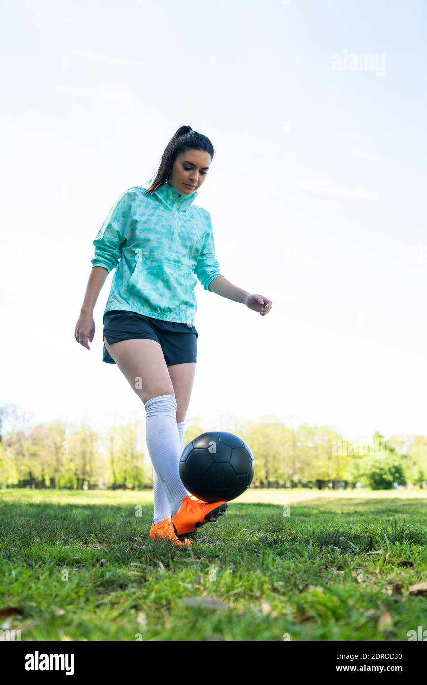 Female athlete is practicing her soccer skills hi-res stock photography ...