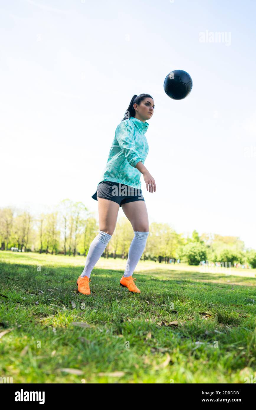 Female athlete is practicing her soccer skills hi-res stock photography ...