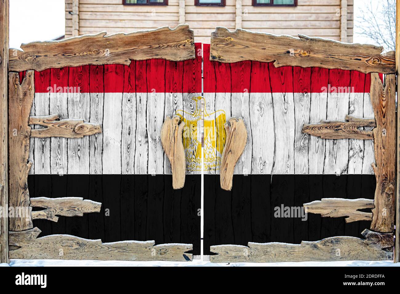 Close-up of the national flag of Egypt on a wooden gate at the entrance ...