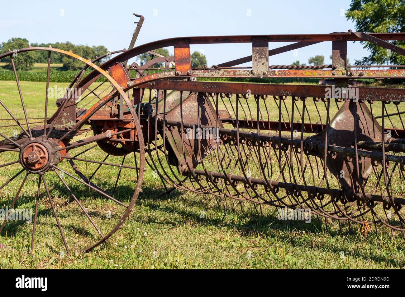 Close up abstract view of an antique tractor drawn windrower farm ...