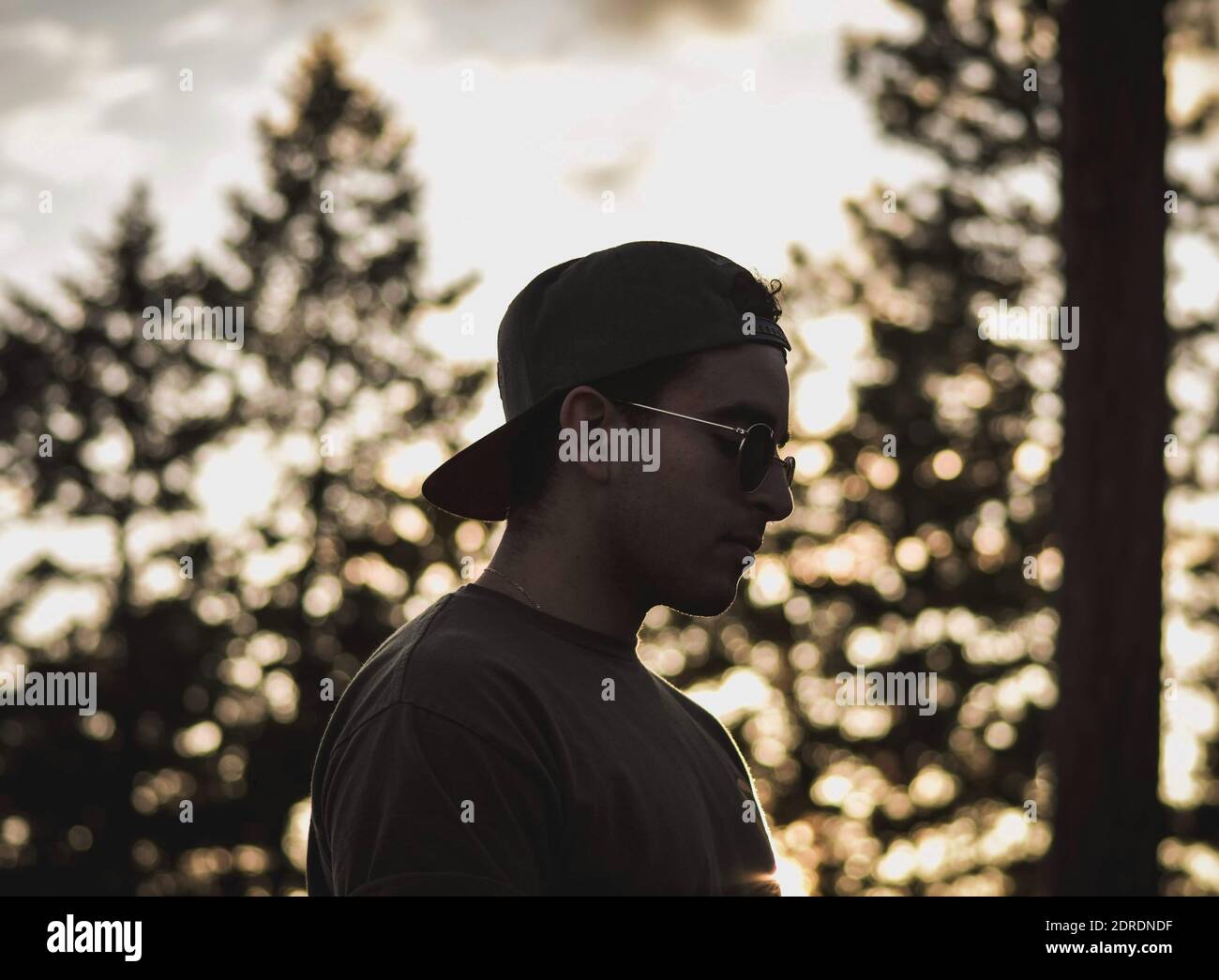 Thoughtful young man wearing cap hi-res stock photography and images ...