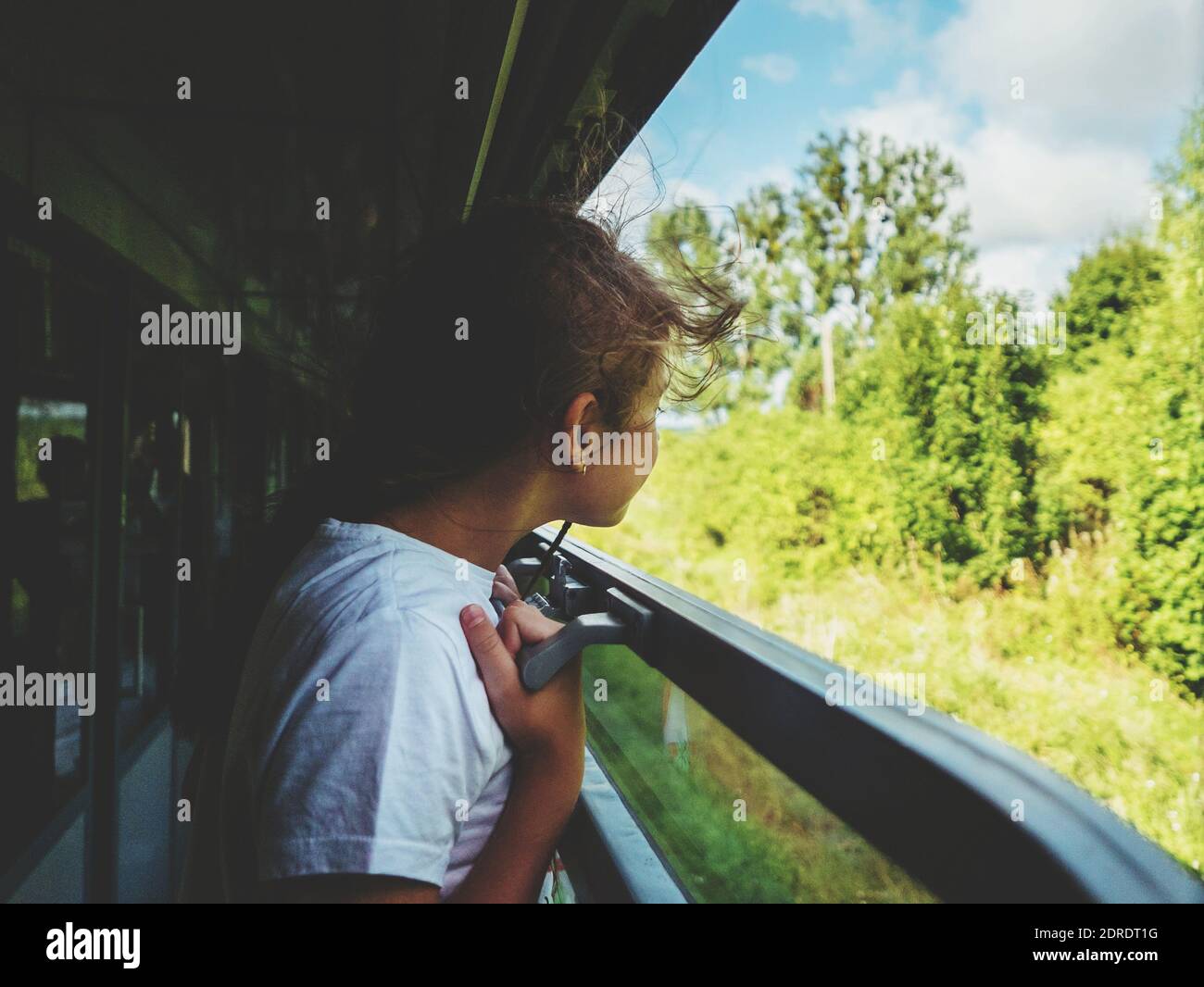 Girls looking through window train hi-res stock photography and images ...