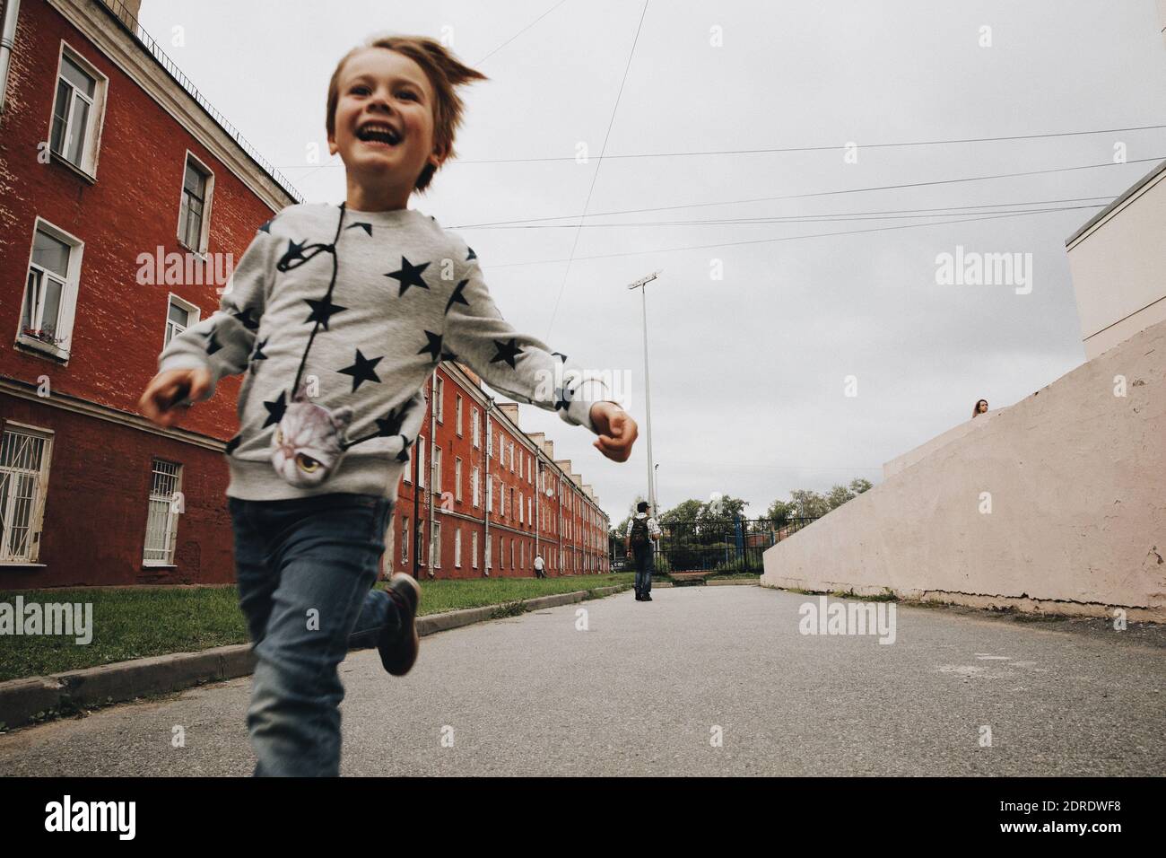 Boys running in the road hi-res stock photography and images - Alamy