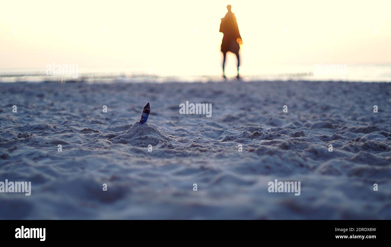 Man On Beach During Sunset Stock Photo - Alamy
