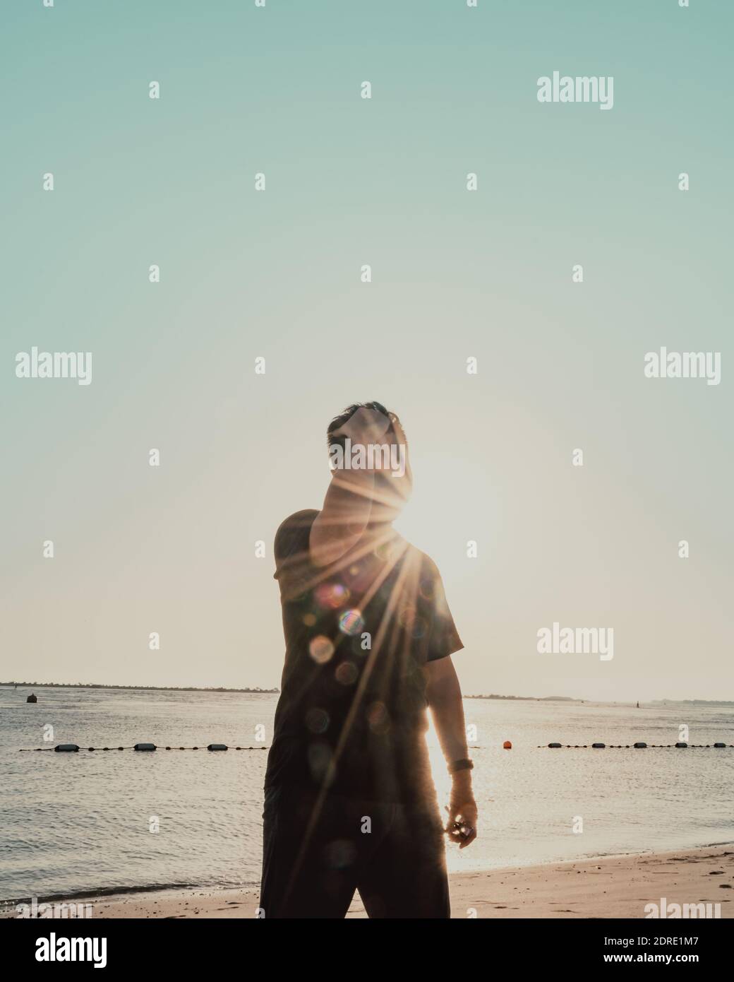 Horizon man looking back flare hi-res stock photography and images - Alamy