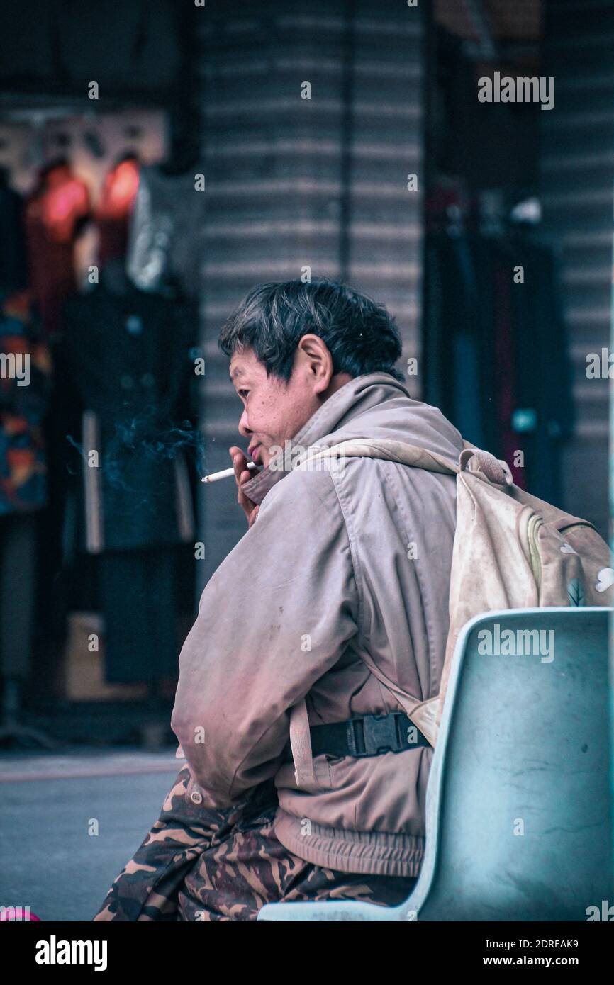 Sitting On Chair And Smoking High Resolution Stock Photography and ...