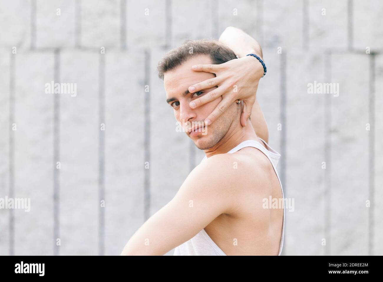 Portrait Of Young Man Dancing Against Wall Stock Photo - Alamy