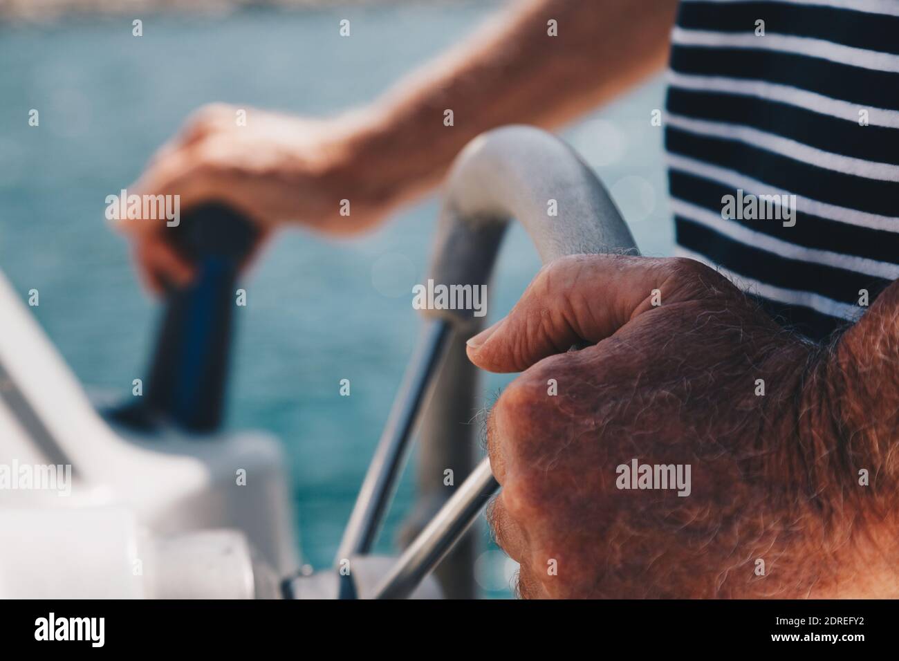 Man at the helm hi-res stock photography and images - Alamy