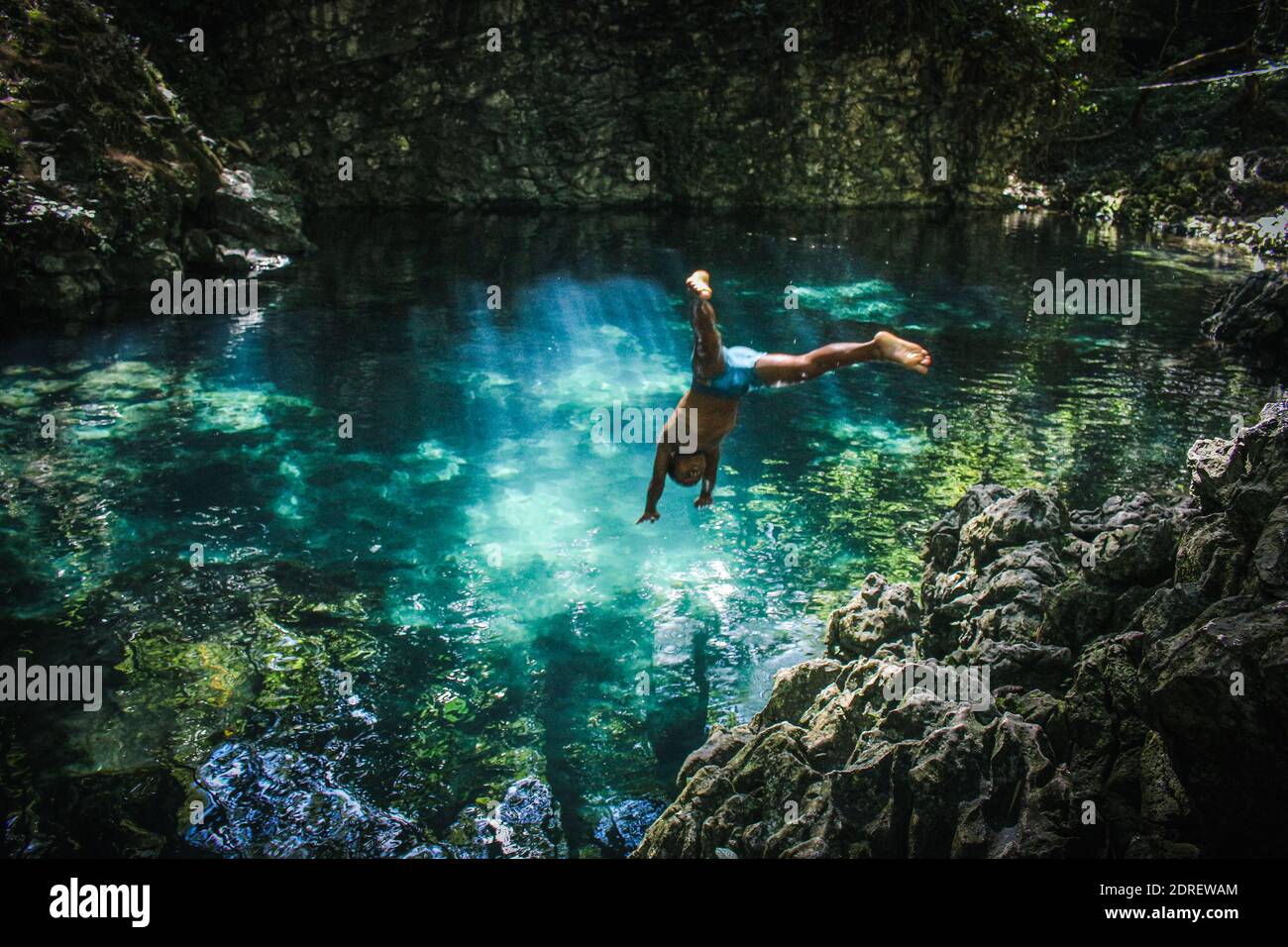 Boy jumping into pond hi-res stock photography and images - Alamy