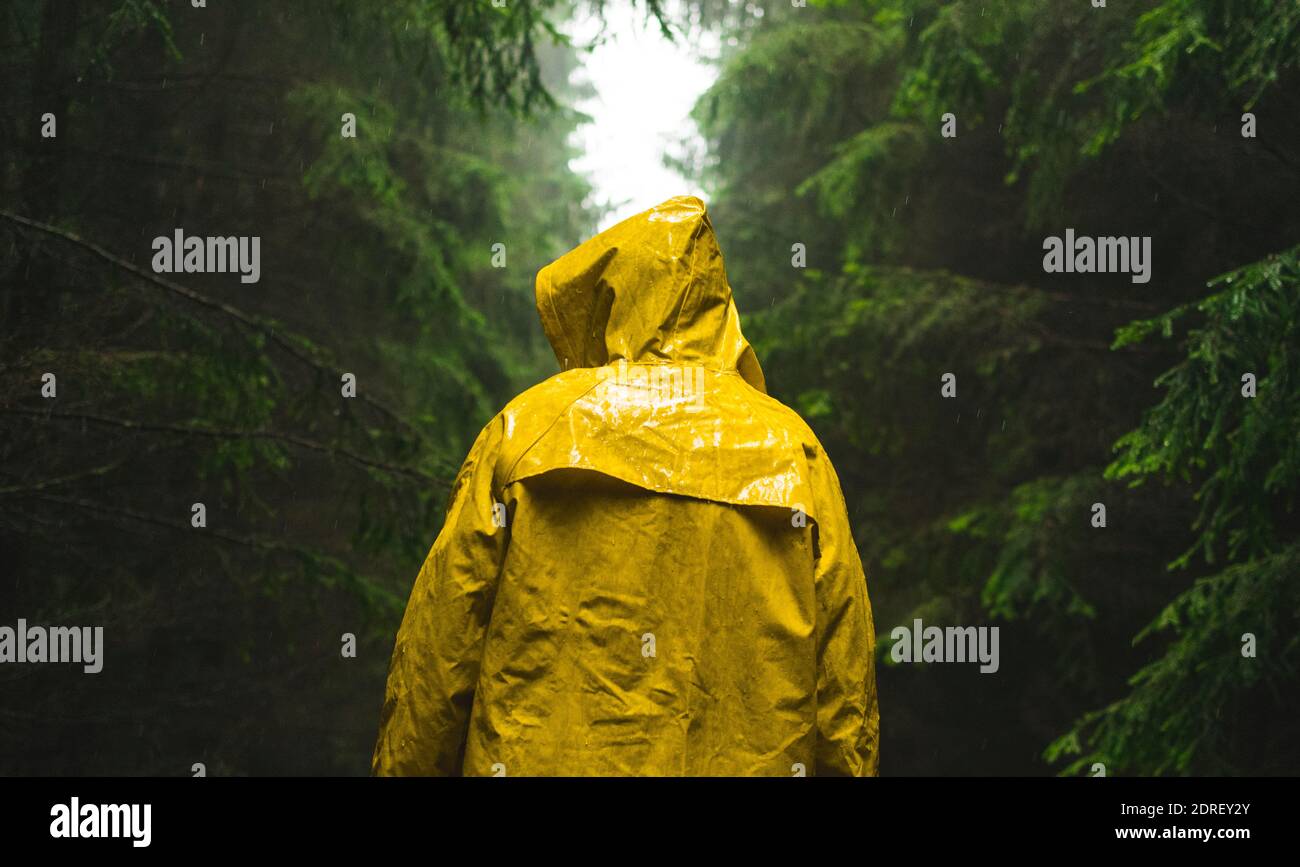 Man standing in rain wearing hi-res stock photography and images - Alamy
