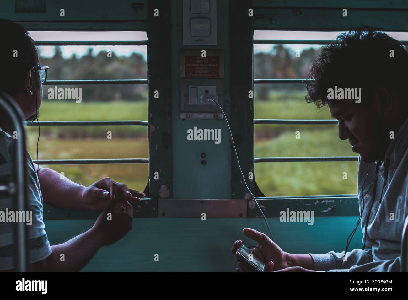 Two Men Sitting In Train High Resolution Stock Photography and Images ...
