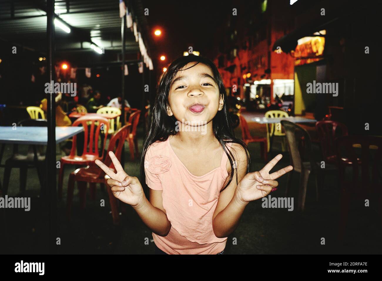 Girl 8 9 sticking out tongue High Resolution Stock Photography and ...