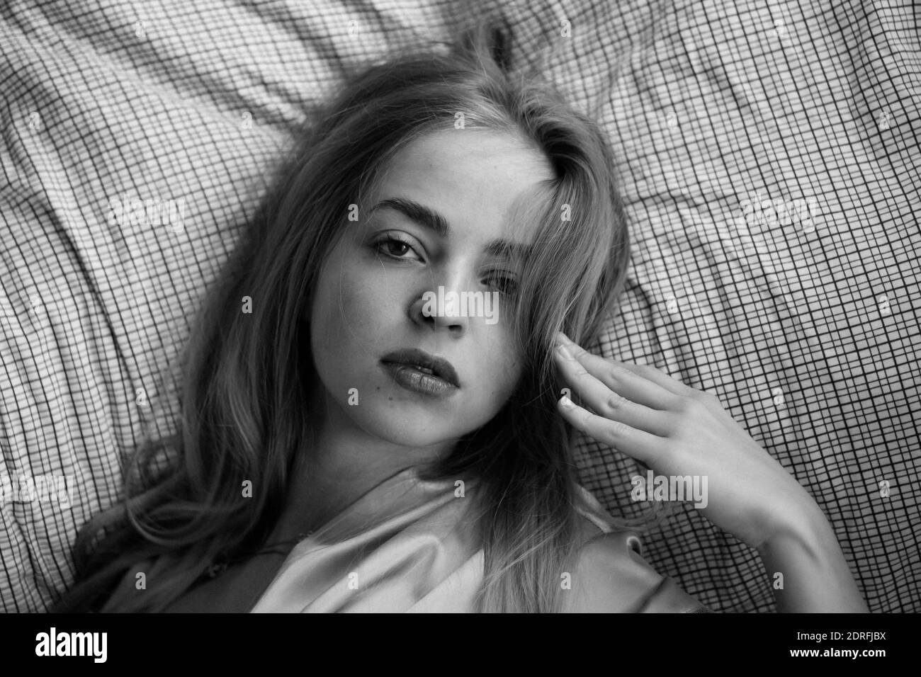 Woman lying on bed back view Black and White Stock Photos & Images - Alamy