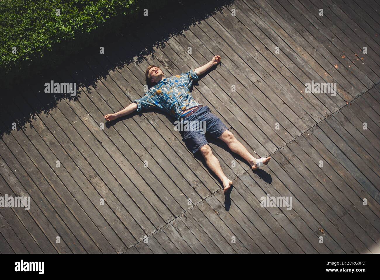 Man lying down arms outstretched hi-res stock photography and images ...
