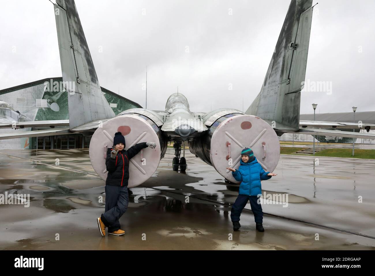 Children on background of Soviet multirole fighter Fulcrum, Russia ...