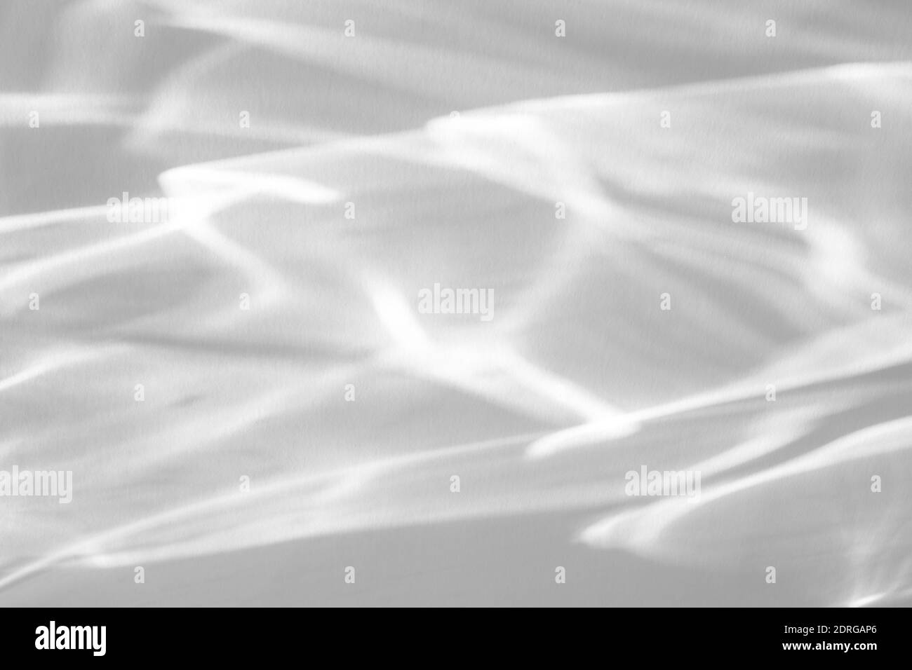 shadow and light caustic effect on a white wall Stock Photo - Alamy