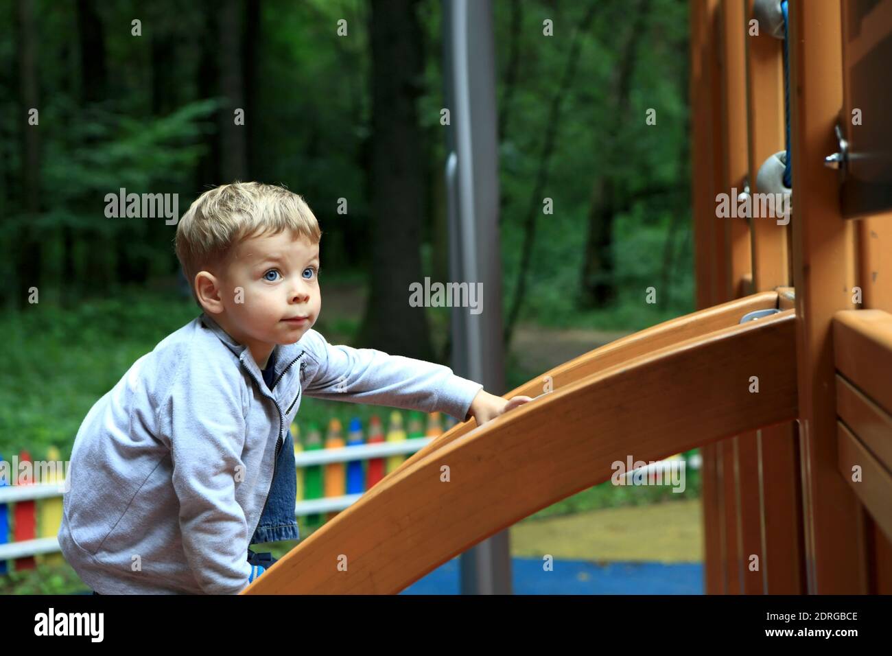 Child climbing up slide hi-res stock photography and images - Alamy