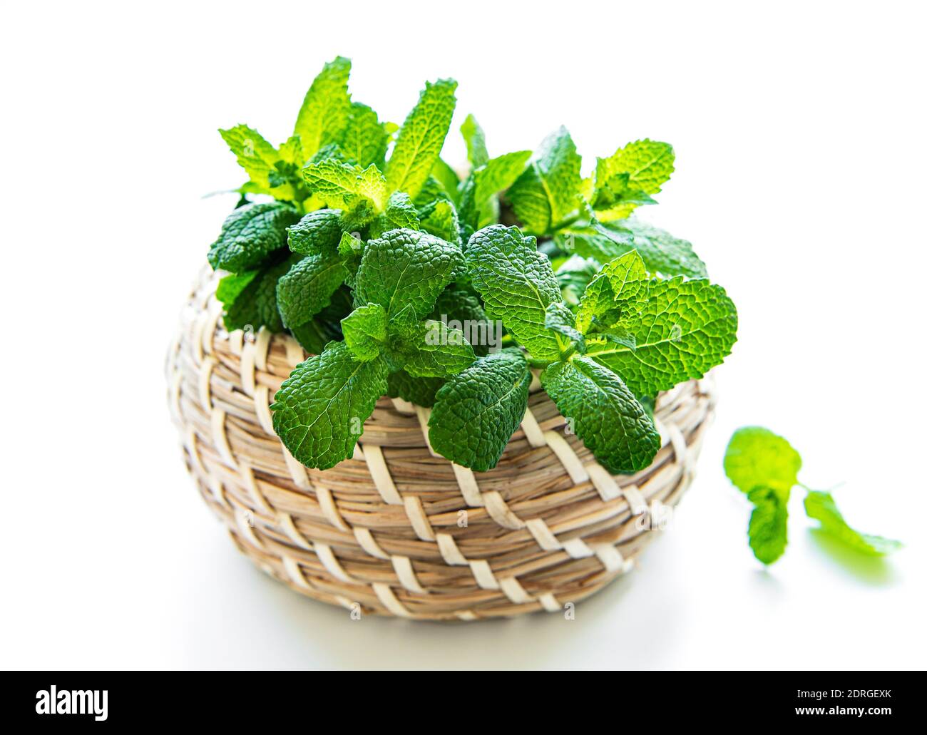 Basket of fresh mint. Isolated on white background Stock Photo - Alamy