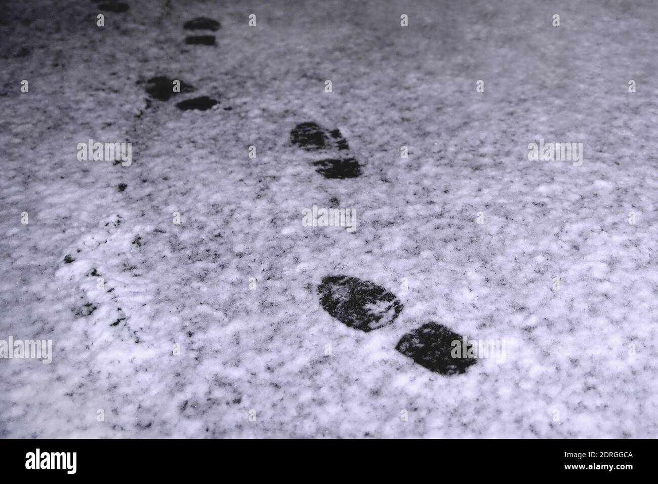 footprints in the snow at night, prints of men's shoes, close-up Stock ...