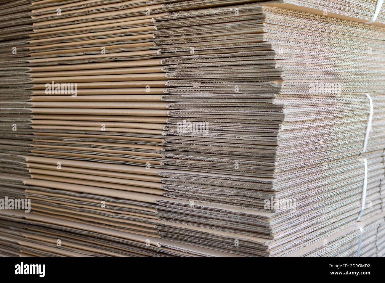 Pile of folded corrugated cardboard Stock Photo - Alamy