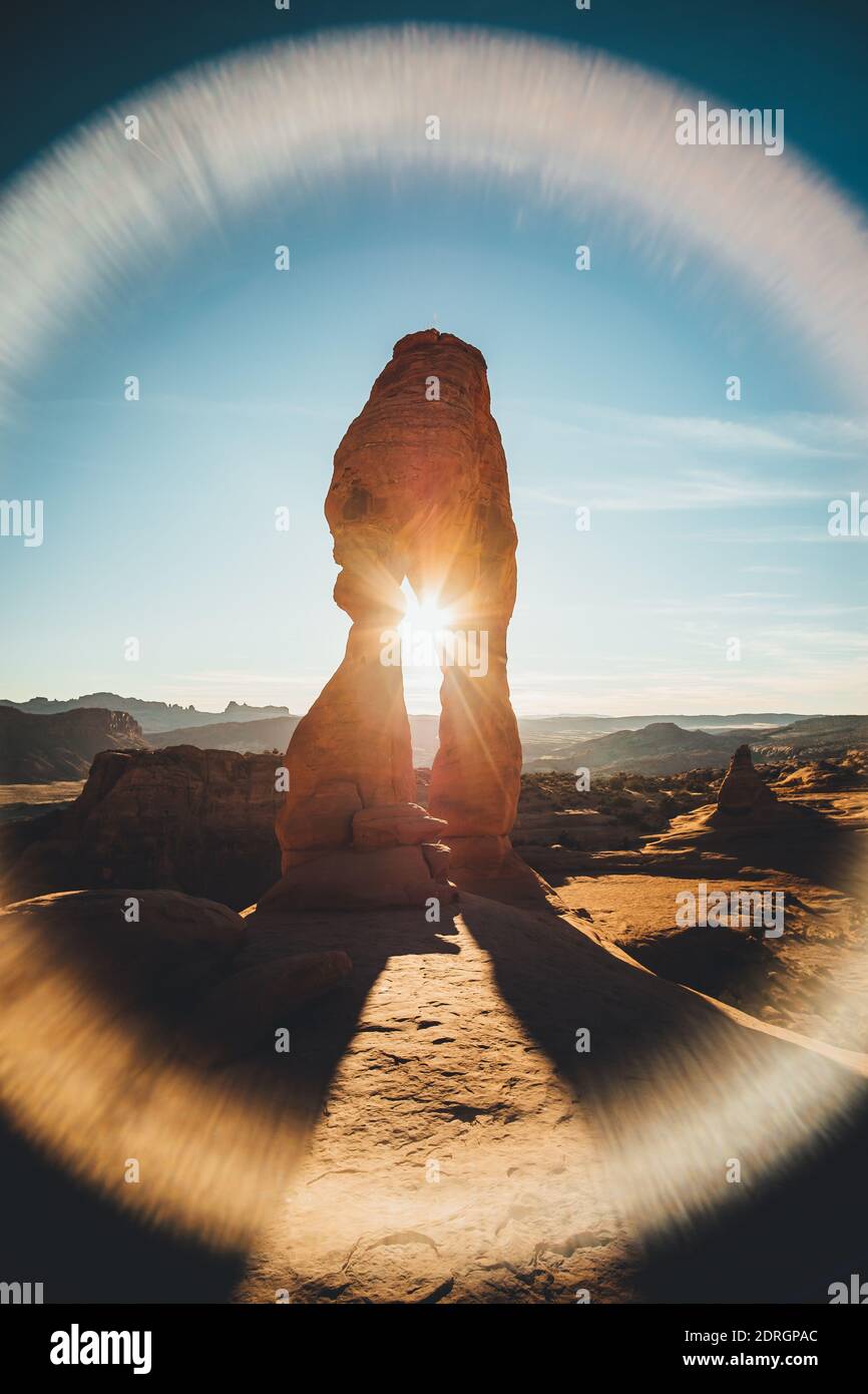 Sun shining through rock formation hi-res stock photography and images ...