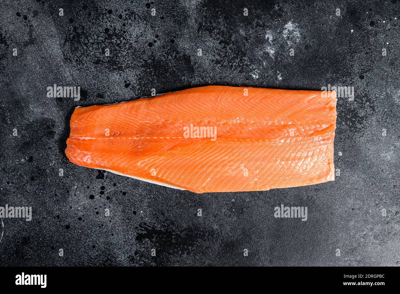 Raw trout fillet. Organic fish. Black background. Top view Stock Photo ...