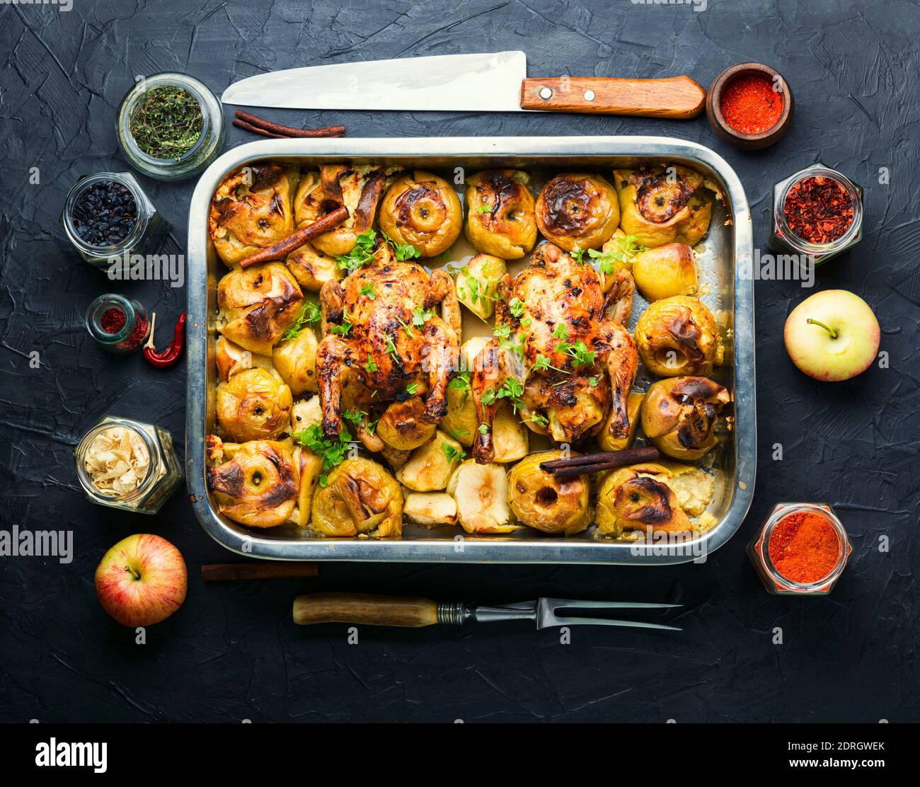 Delicious baked partridge with apples in tray.Homemade baked chicken ...